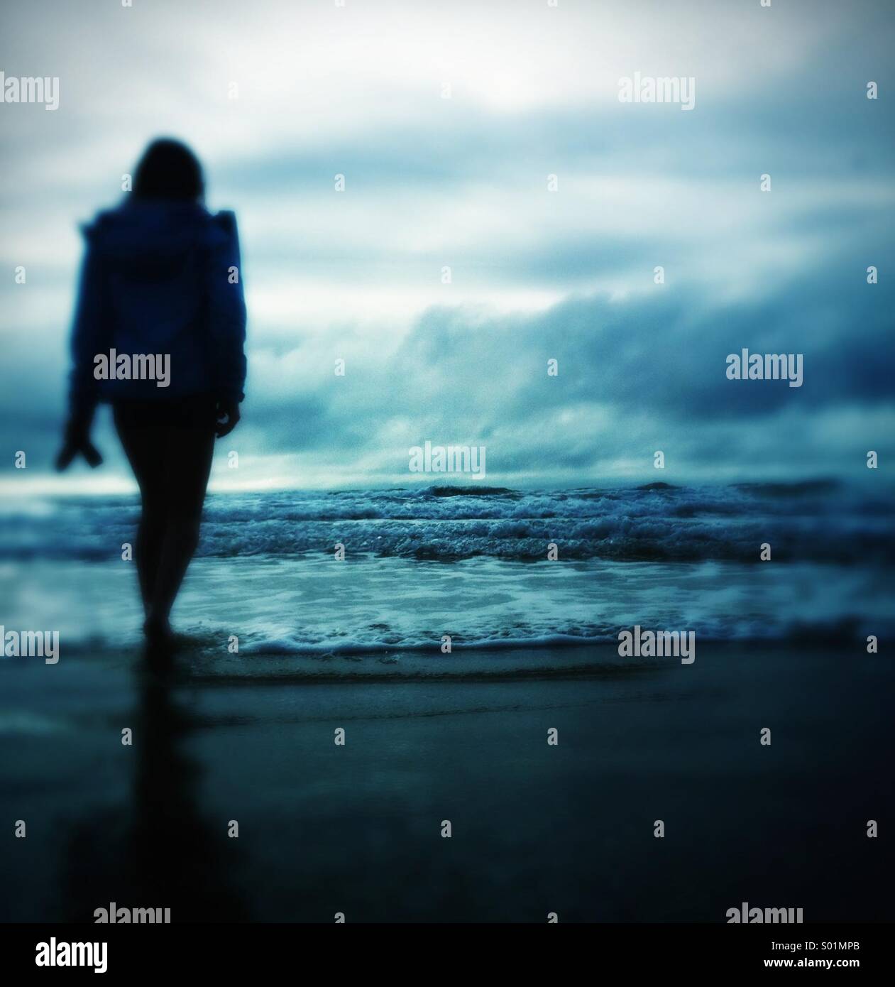 girl walking on beach Stock Photo - Alamy