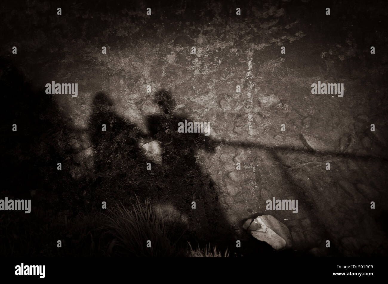 Shadows of two people reflected in water Stock Photo - Alamy