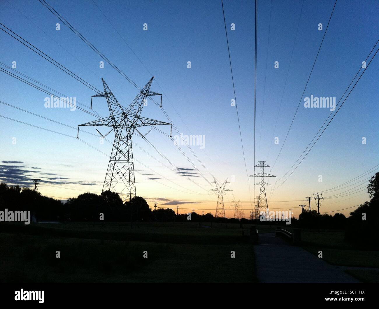Electric pylons at sunrise in Texas Stock Photo - Alamy