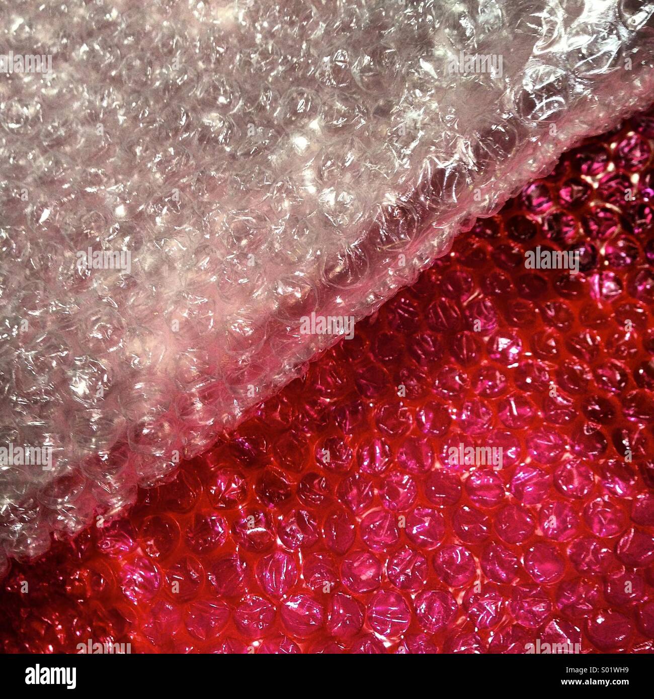 White and red bubble wrap Stock Photo - Alamy