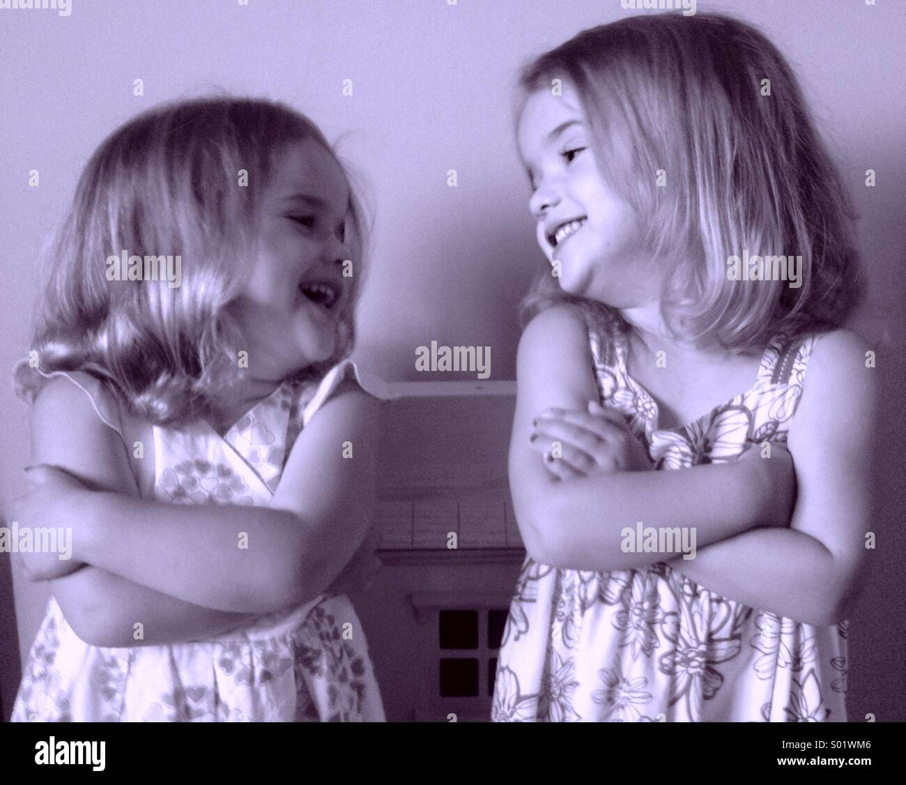Laughing twins hi-res stock photography and images - Alamy