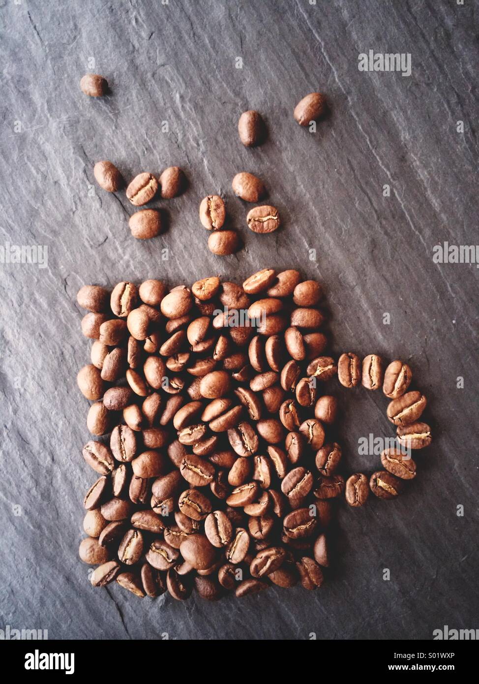 Coffee beans shaped to resemble a cup of coffee Stock Photo - Alamy