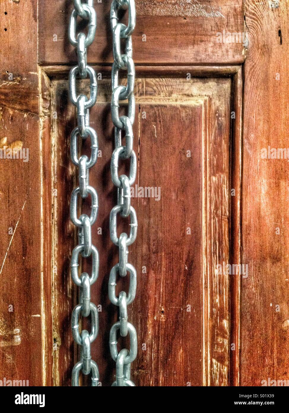 Chains with wood doors Stock Photo - Alamy