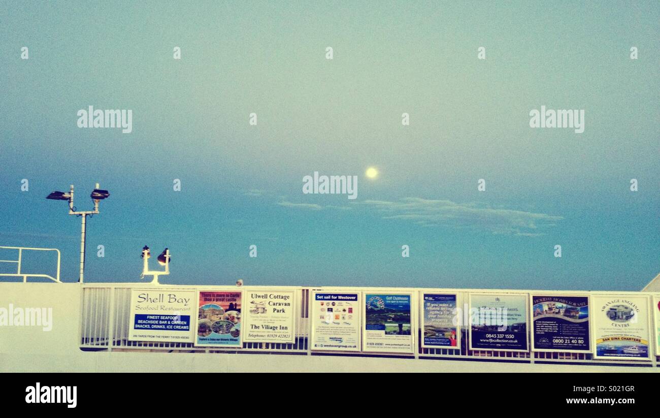 Full moon at dusk on the Sandbanks ferry Stock Photo - Alamy