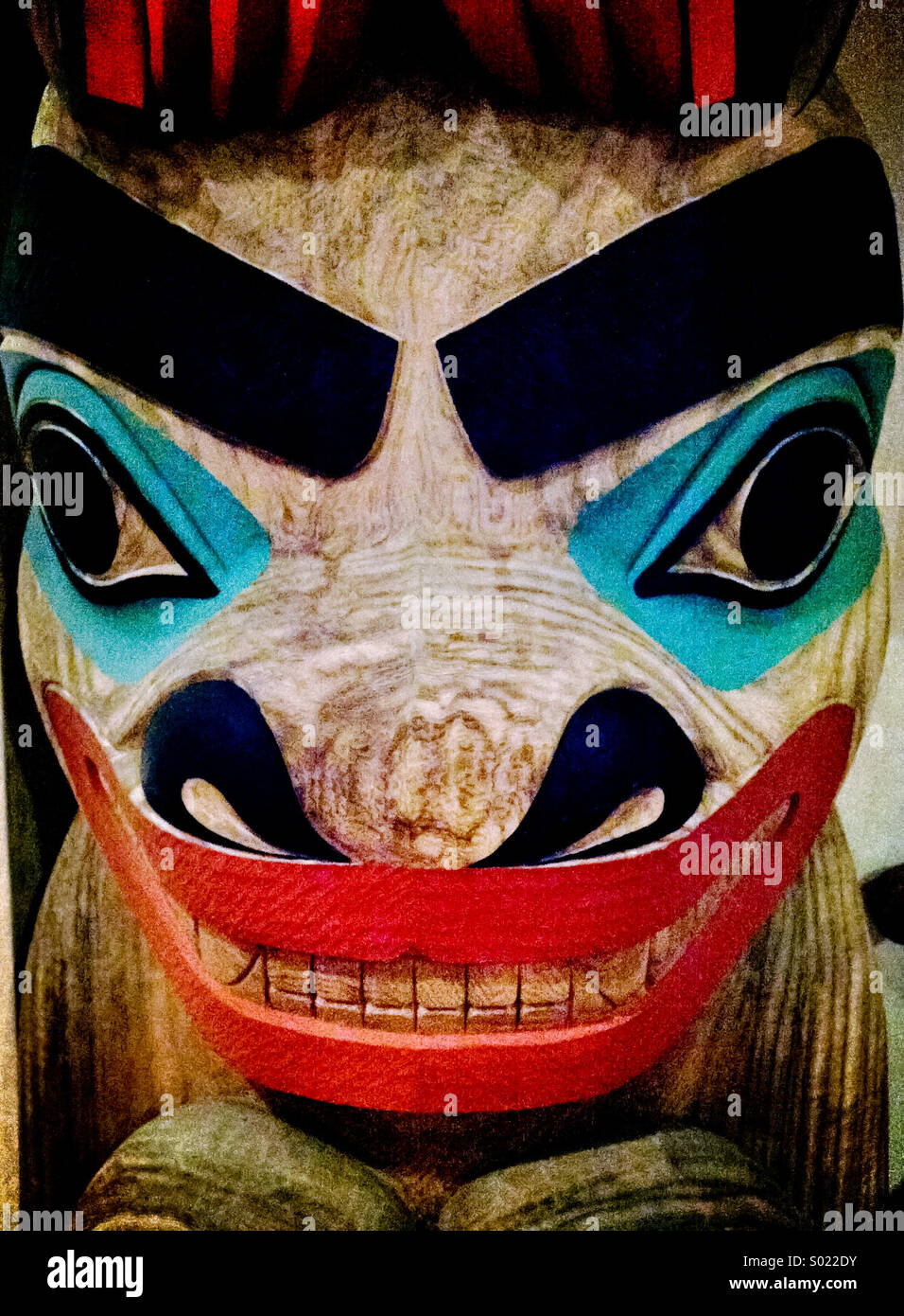 An ominous face is part of a totem pole Stock Photo - Alamy