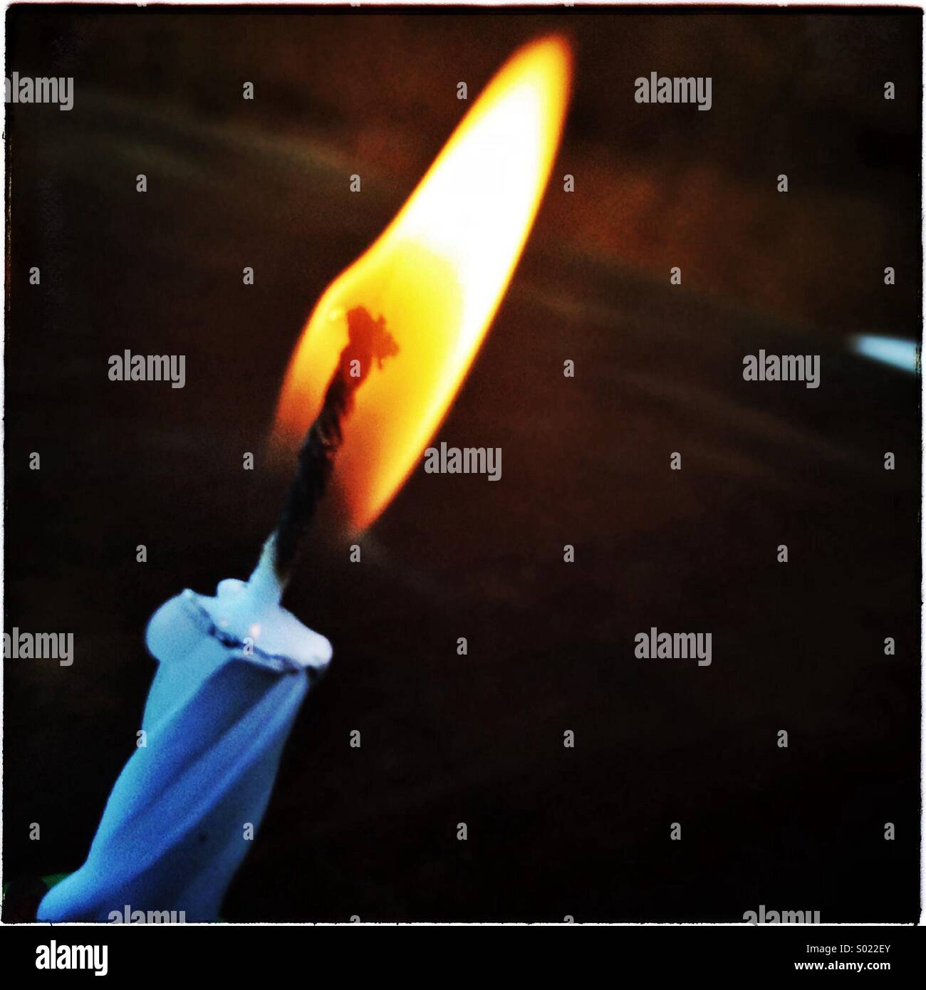 Single flame of a one birthday candle light Stock Photo - Alamy