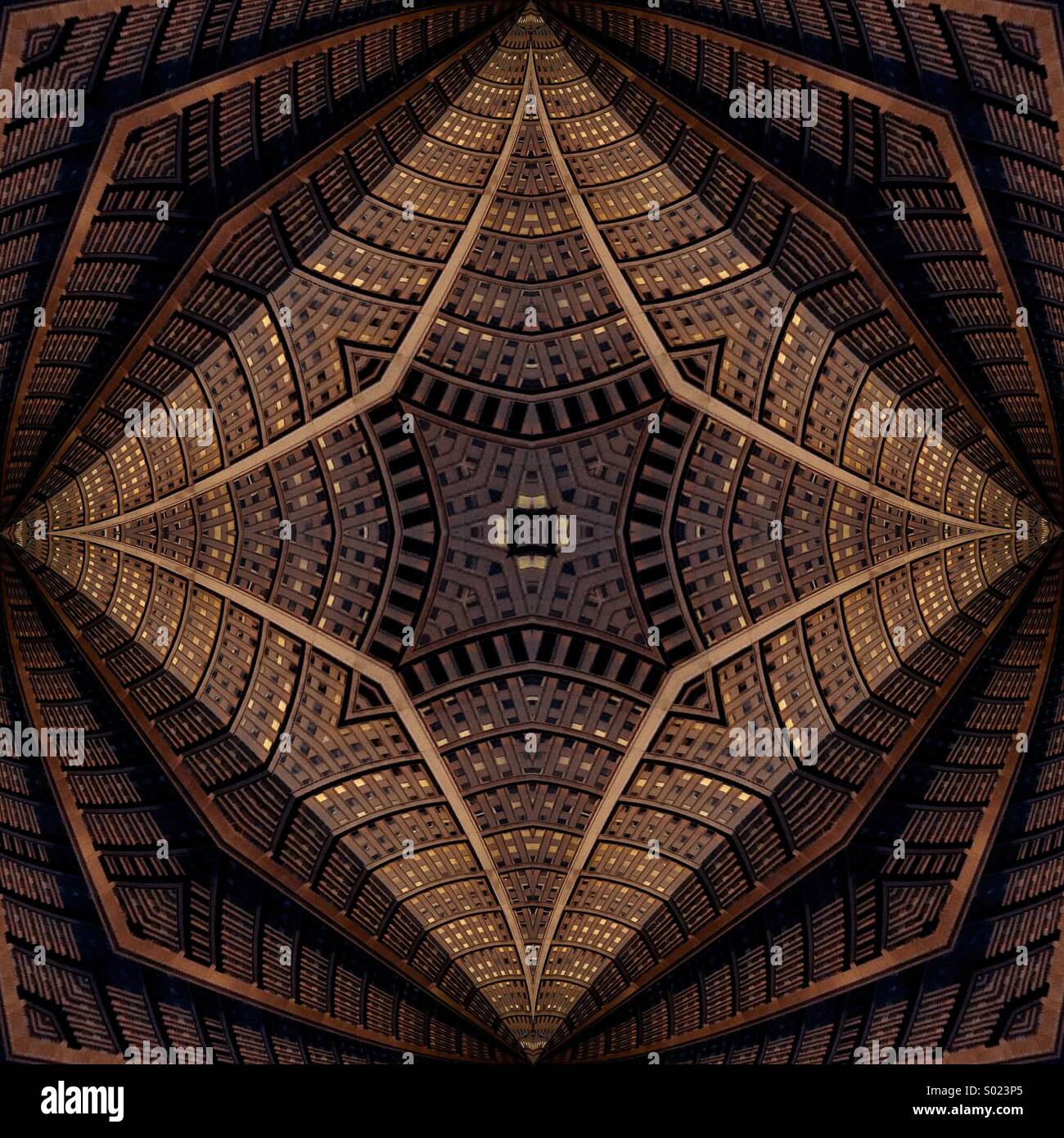 A star created from a kaleidoscope pattern of brown ridges Stock Photo ...