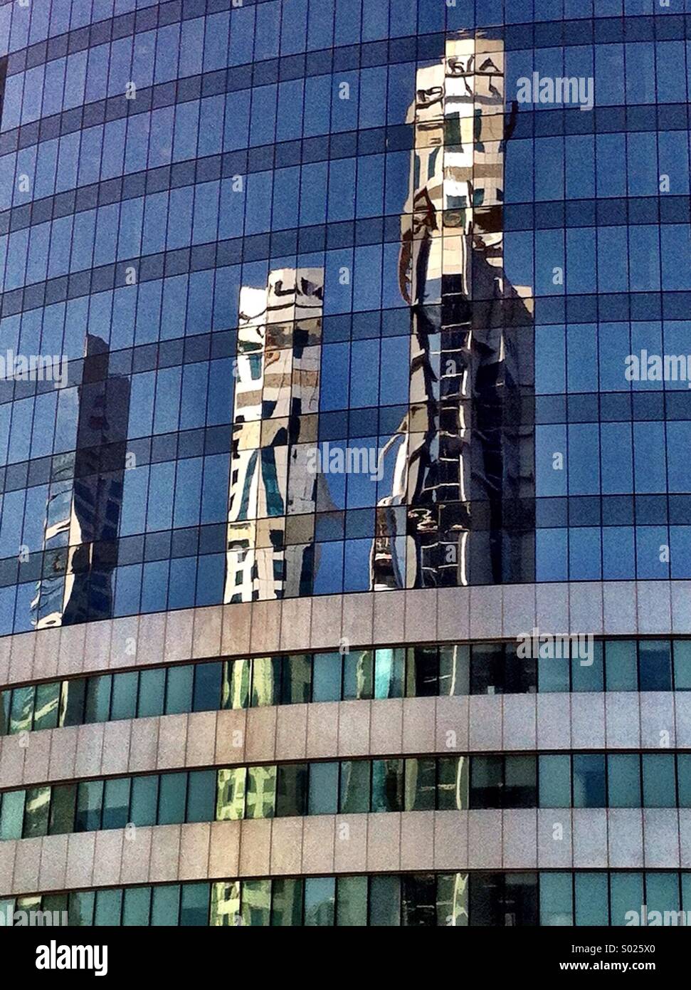 Skyscrapers reflected in glass facade, Doha Stock Photo - Alamy