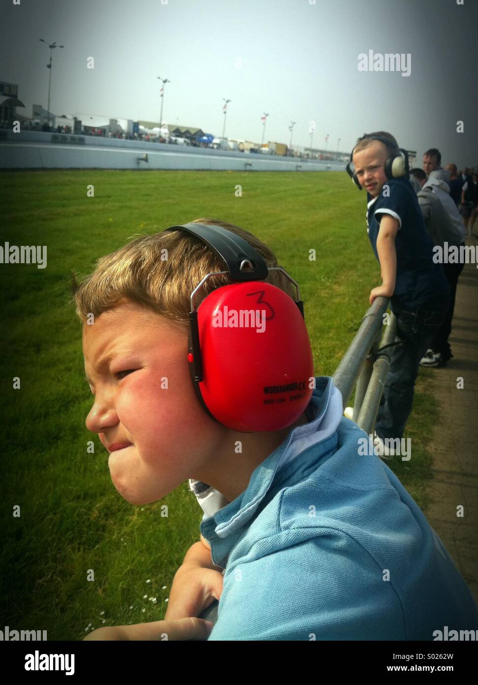 A young boy looks intensely towards the start line at Santa Pod drag ...