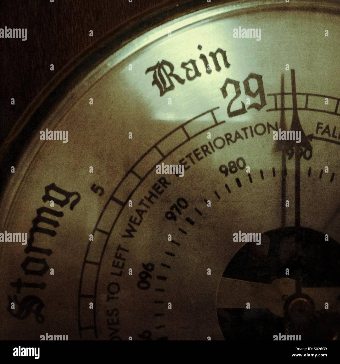Pointer on a barometer showing between rain and change Stock Photo - Alamy