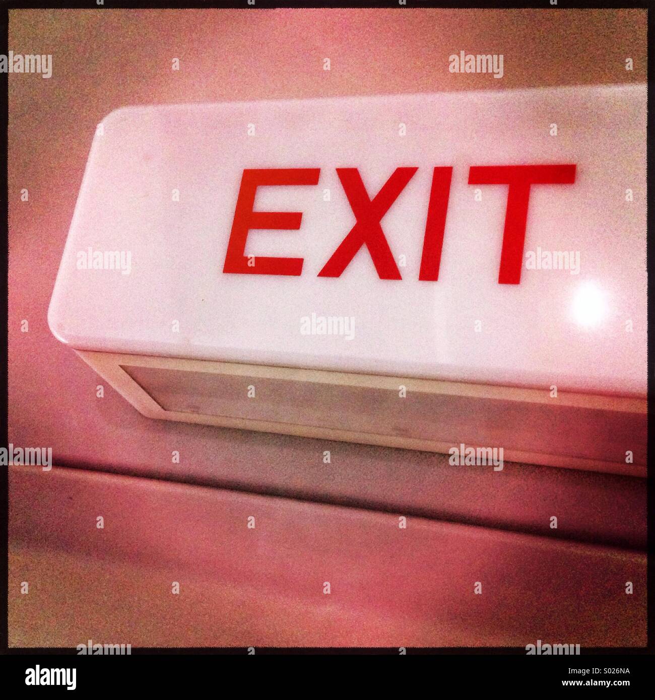 Exit sign on aircraft Stock Photo - Alamy