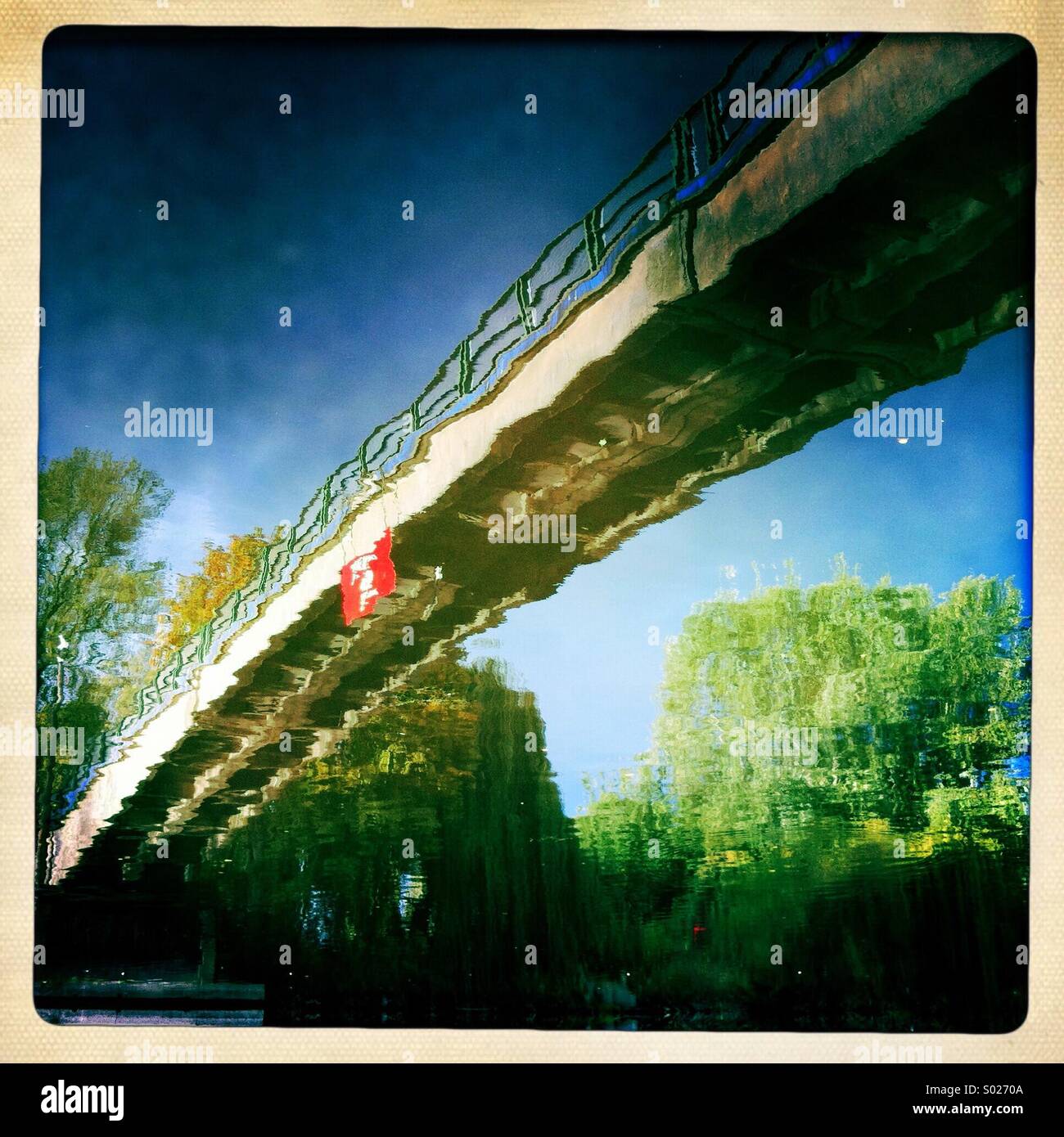 Bridge reflection in water Stock Photo - Alamy