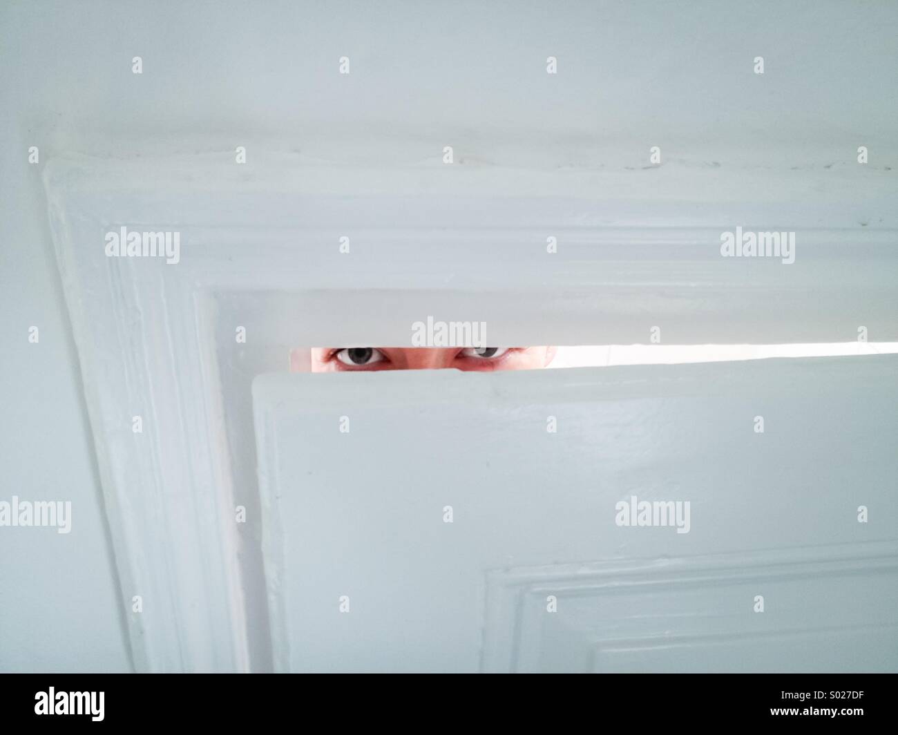 Hide behind door hi-res stock photography and images - Alamy