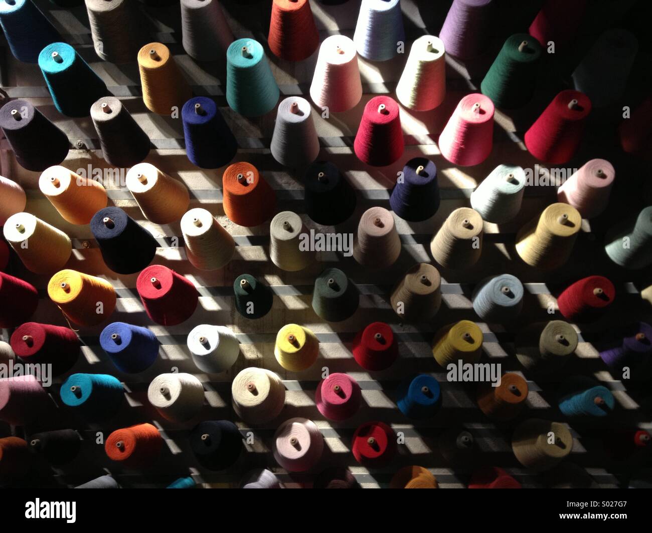 colourful rolls of thread Stock Photo - Alamy