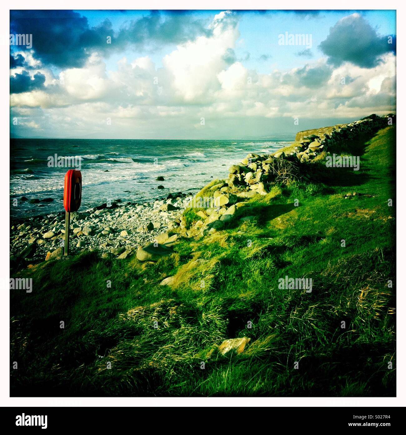 Red life buoy stand on beach Stock Photo - Alamy