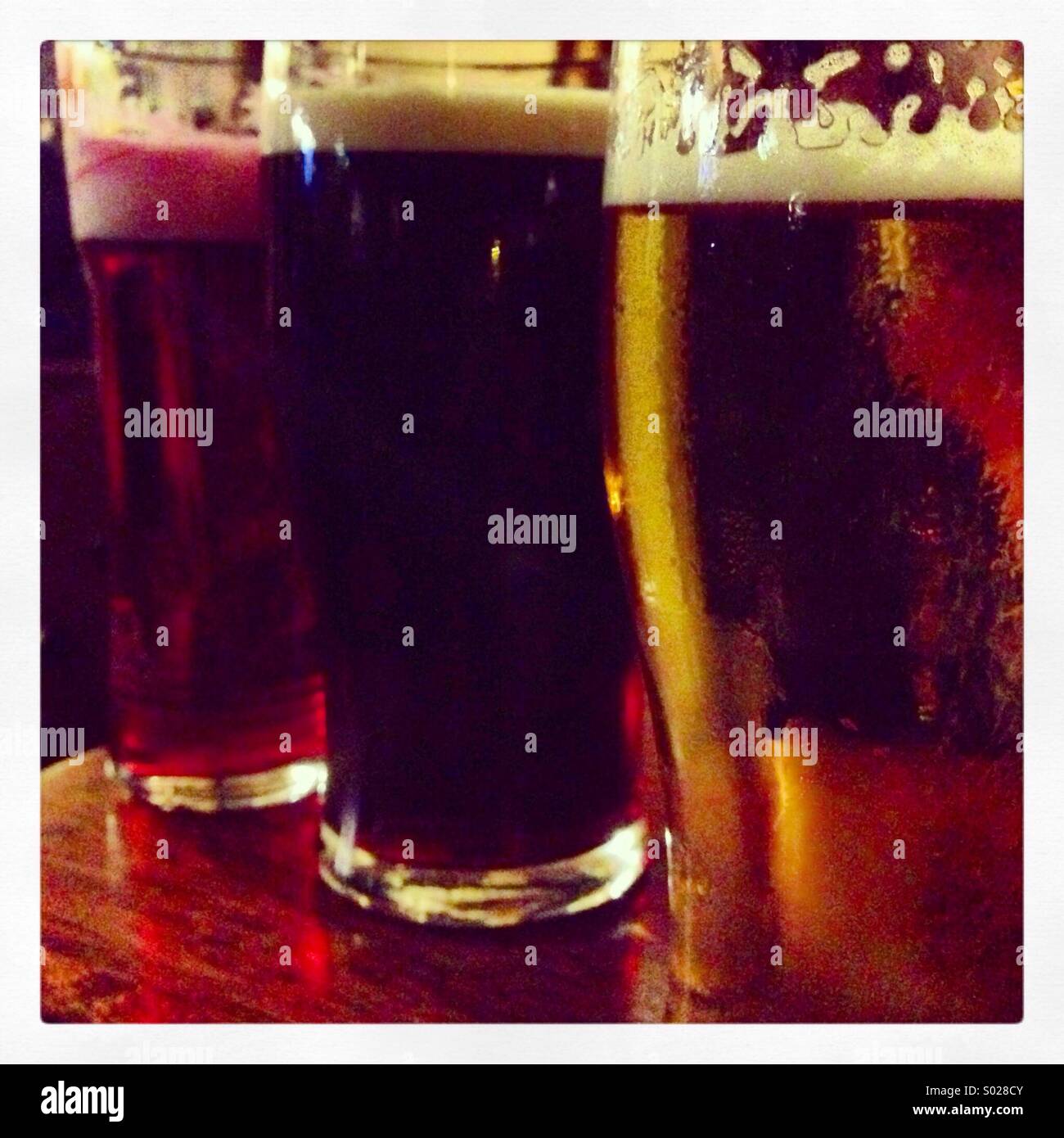Pints of beer on a bar Stock Photo - Alamy