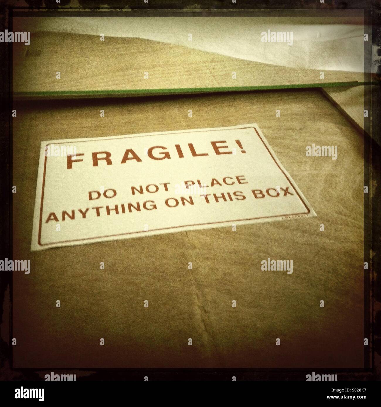 Warning on wooden cargo box Stock Photo - Alamy