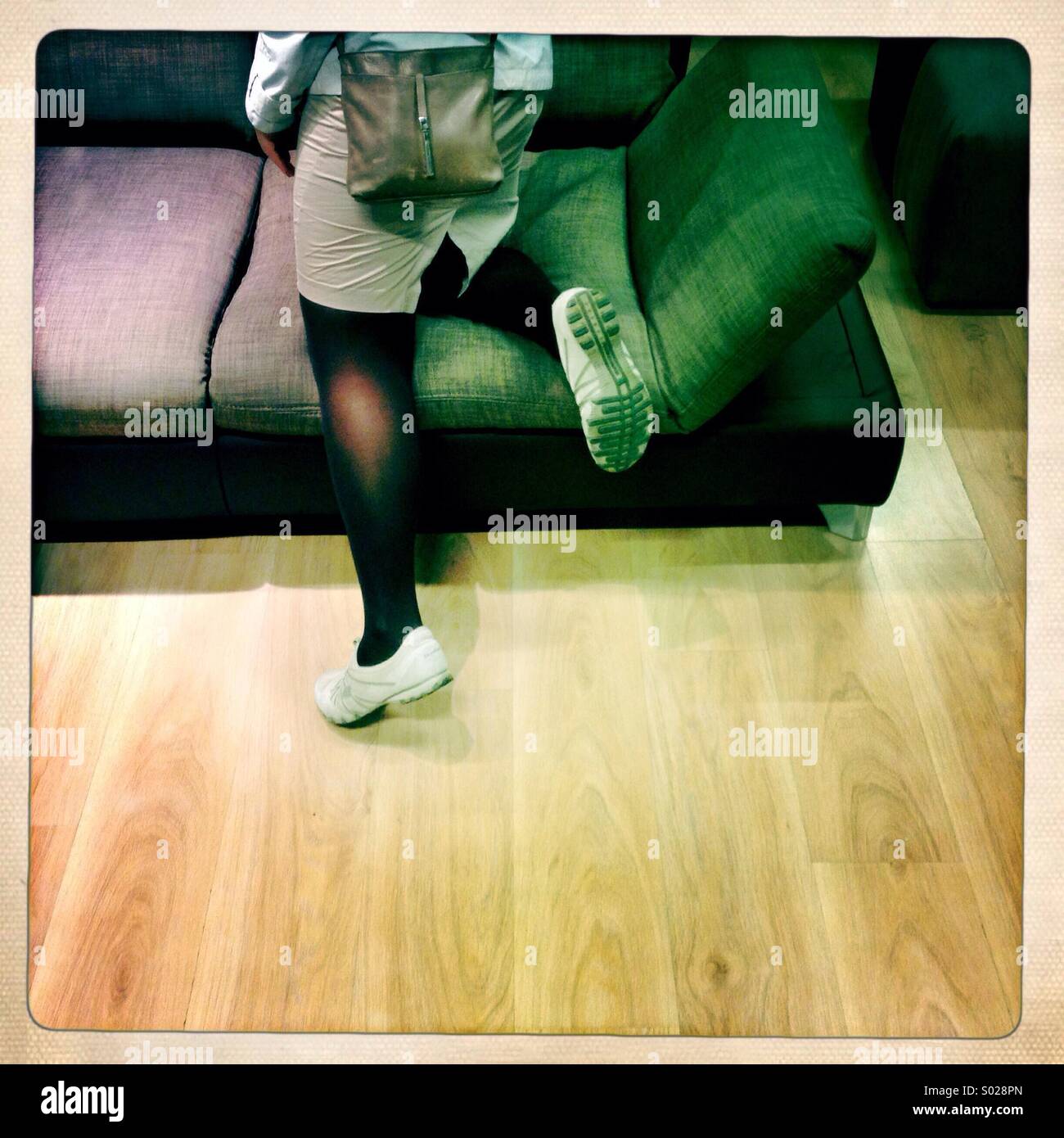 A woman is seen looking at a couch in a large retail store in Bydgoszcz ...