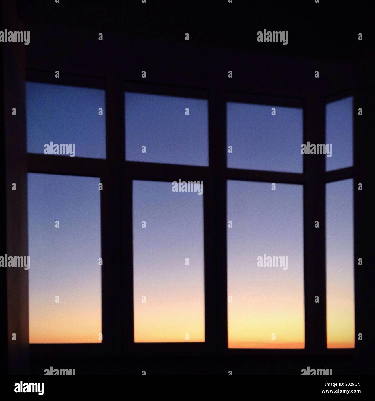 Sunset sky in window Stock Photo - Alamy
