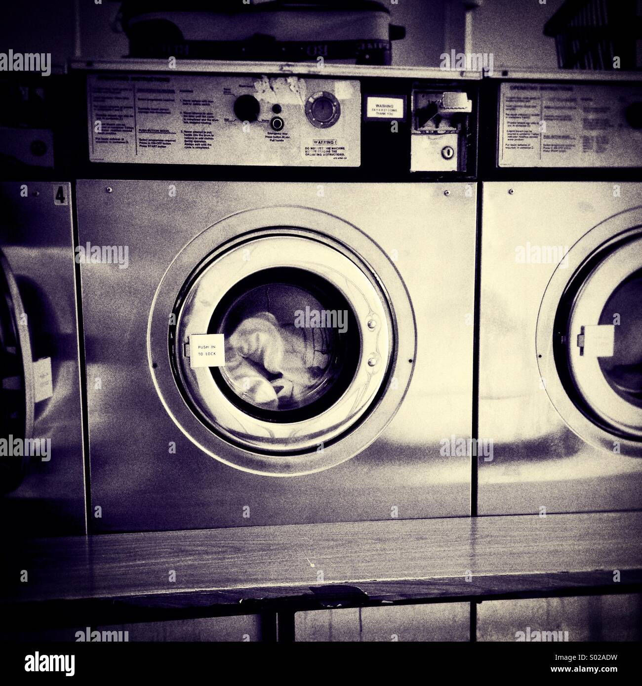 Laundry washing machine clothes smartphone stock photos and images - Alamy
