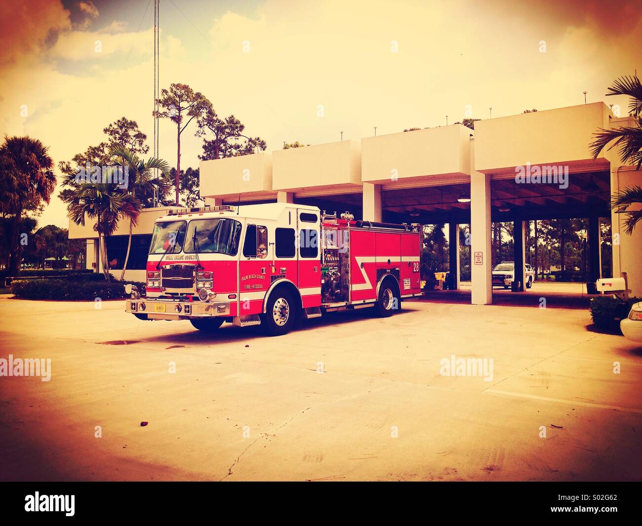 Fire truck at fire station Stock Photo - Alamy