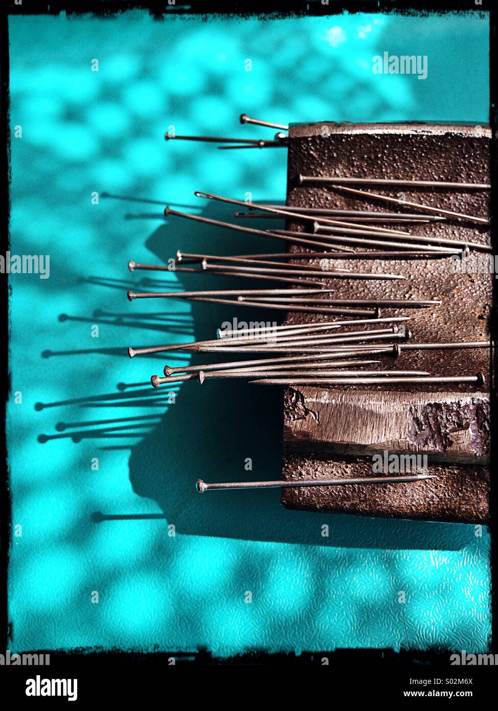 Magnet and needles Stock Photo - Alamy