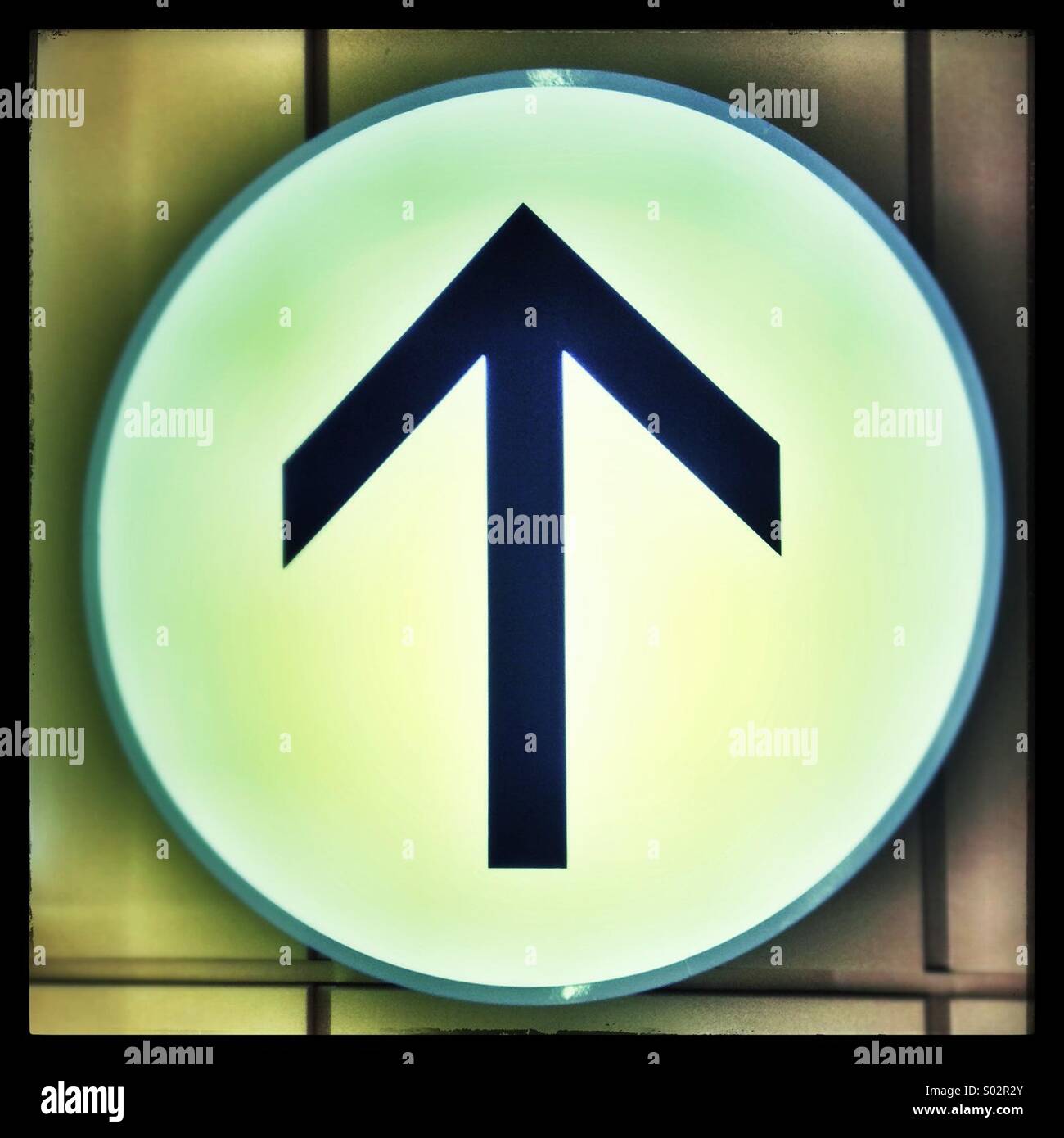 Arrow sign pointing upwards Stock Photo - Alamy