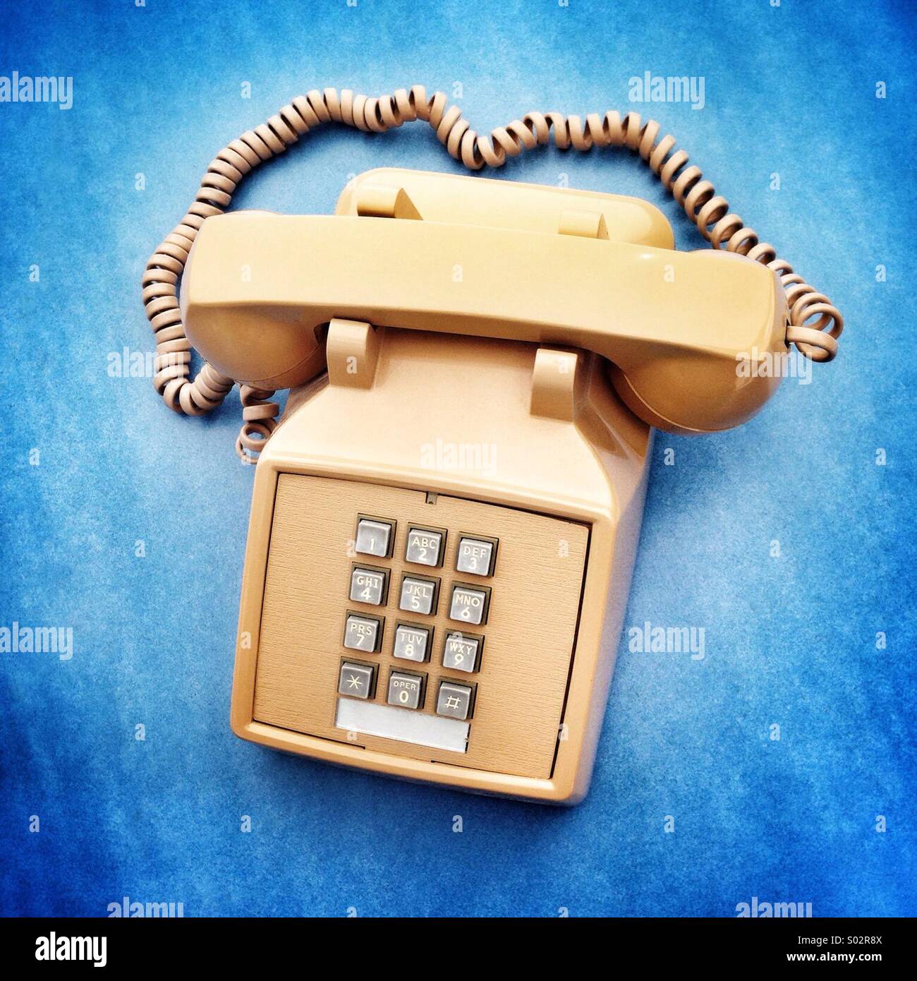 Punch button retro land line phone Stock Photo - Alamy