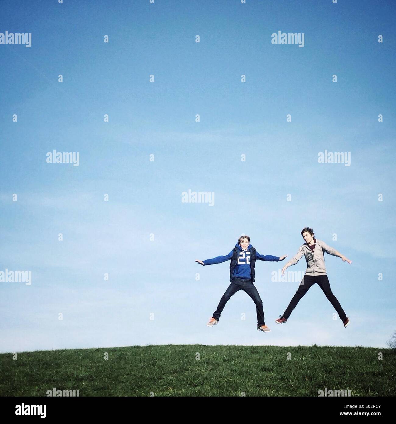Friendship jump hi-res stock photography and images - Alamy