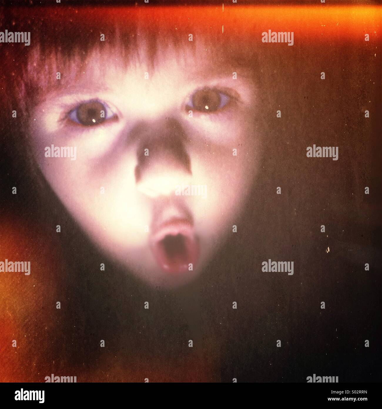 Girl making a spooky face Stock Photo - Alamy