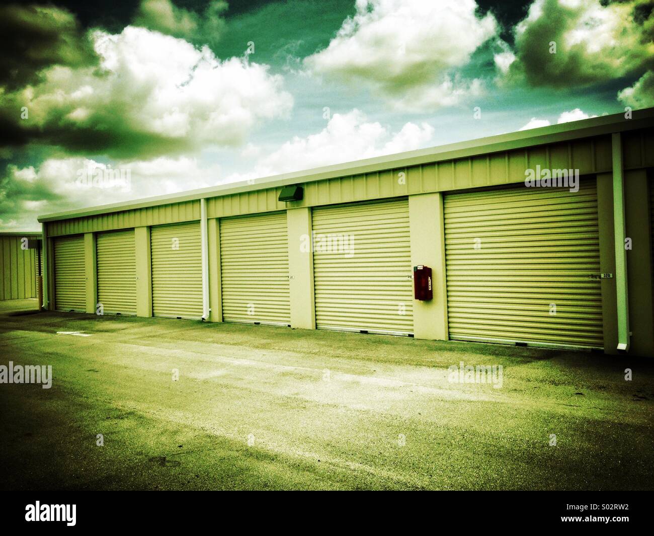Warehouse doors on self storage units Stock Photo - Alamy
