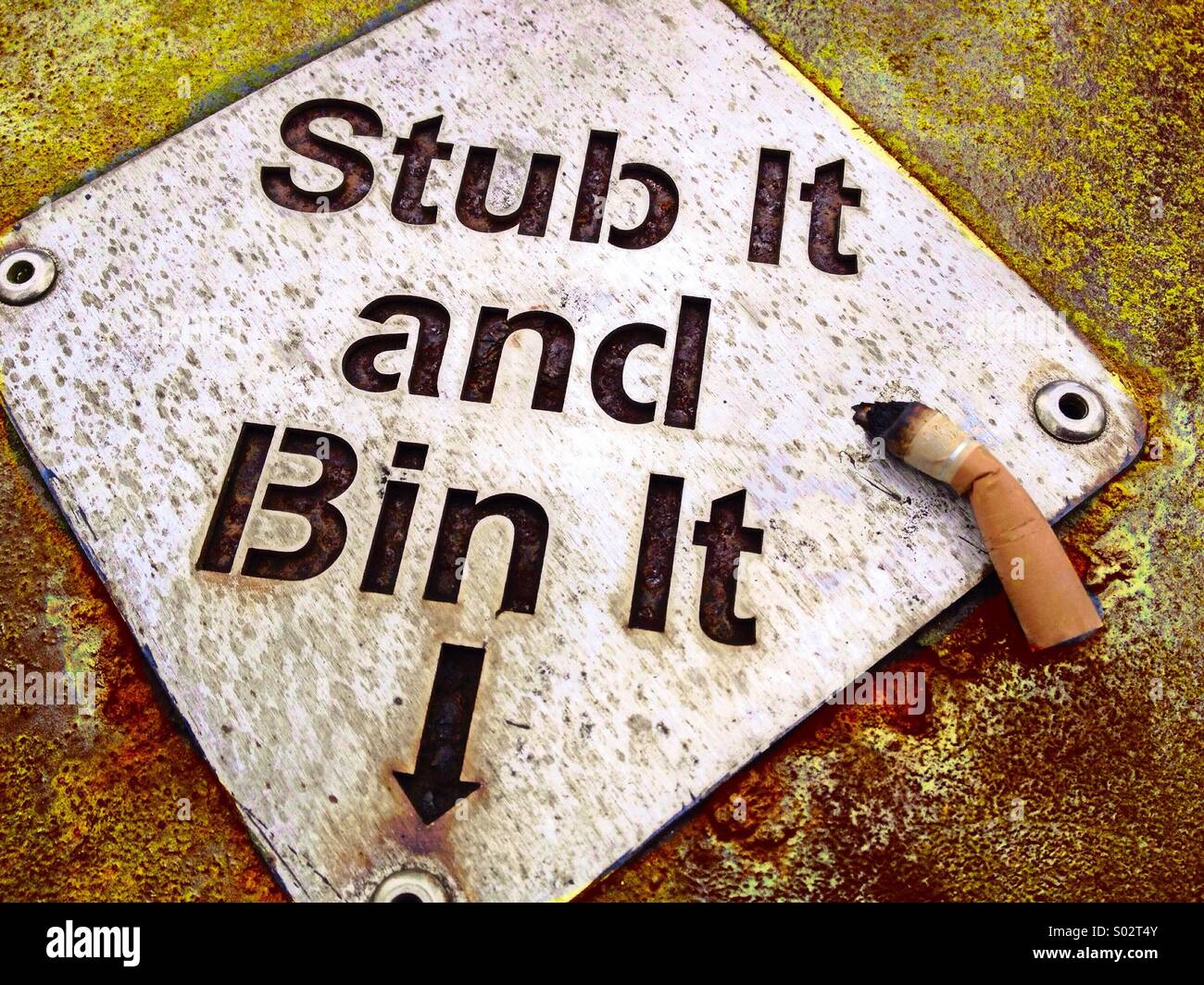 Stub it and bin it sign on waste bin with cigarette butt Stock Photo ...