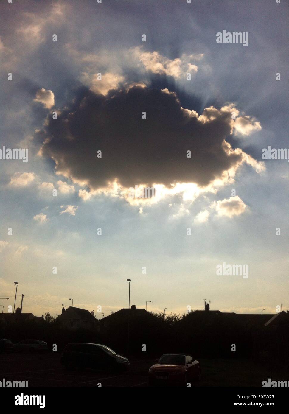 Round cloud blocking the sun on a clear day Stock Photo - Alamy