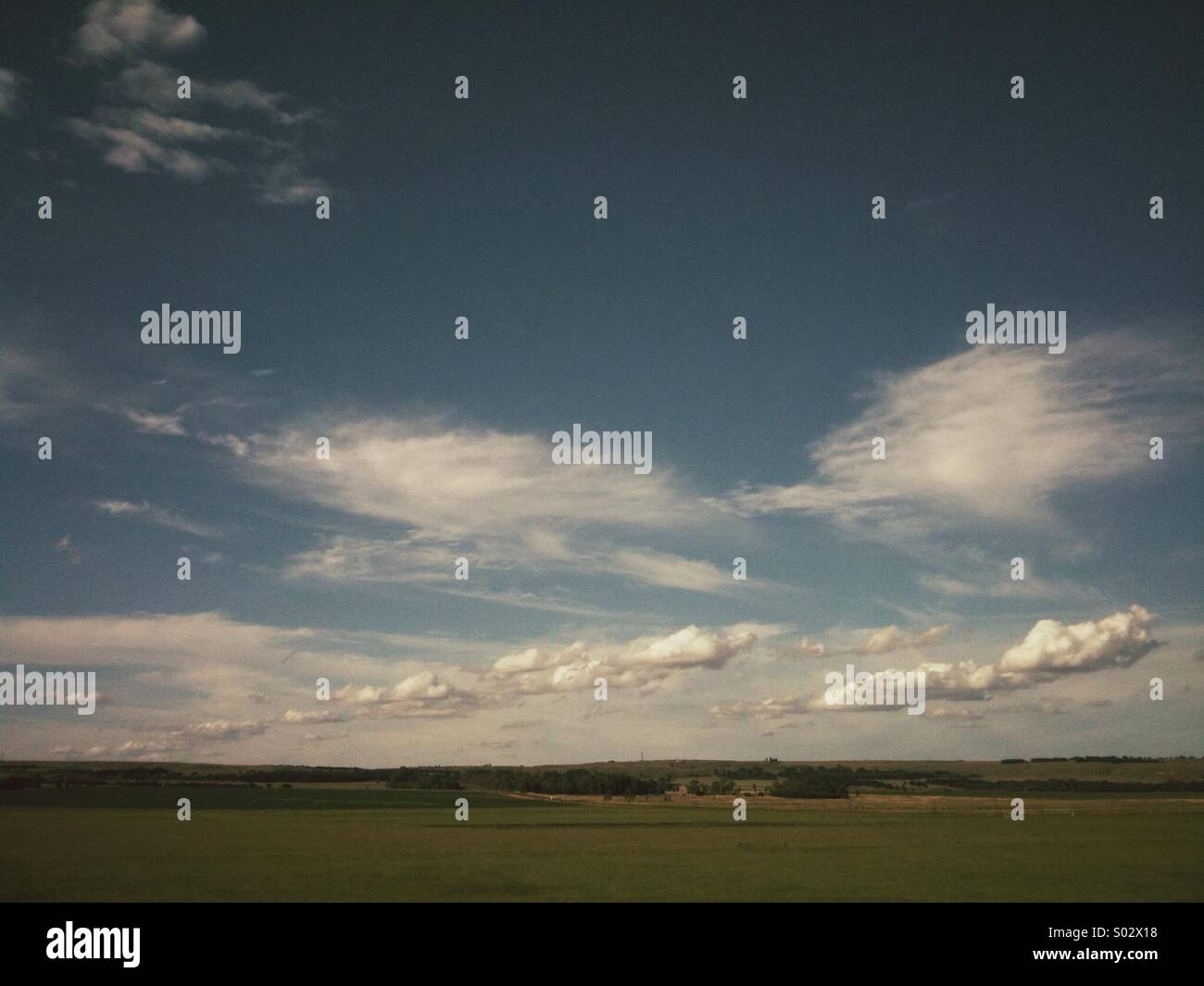 Landscape view of farm lands with blue sky and clouds with fields of ...