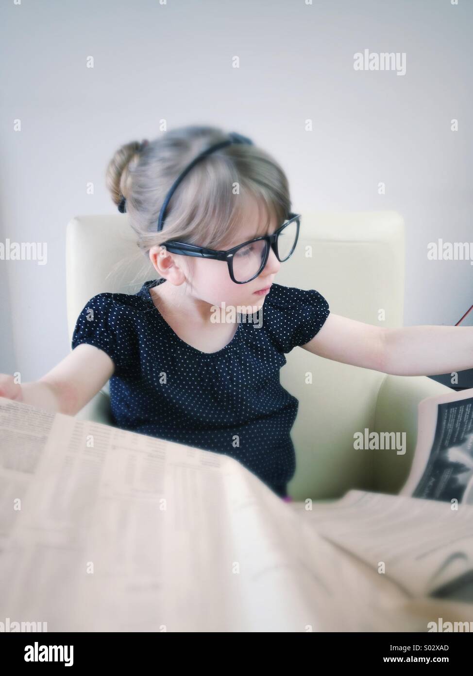 Child newspaper hi-res stock photography and images - Alamy