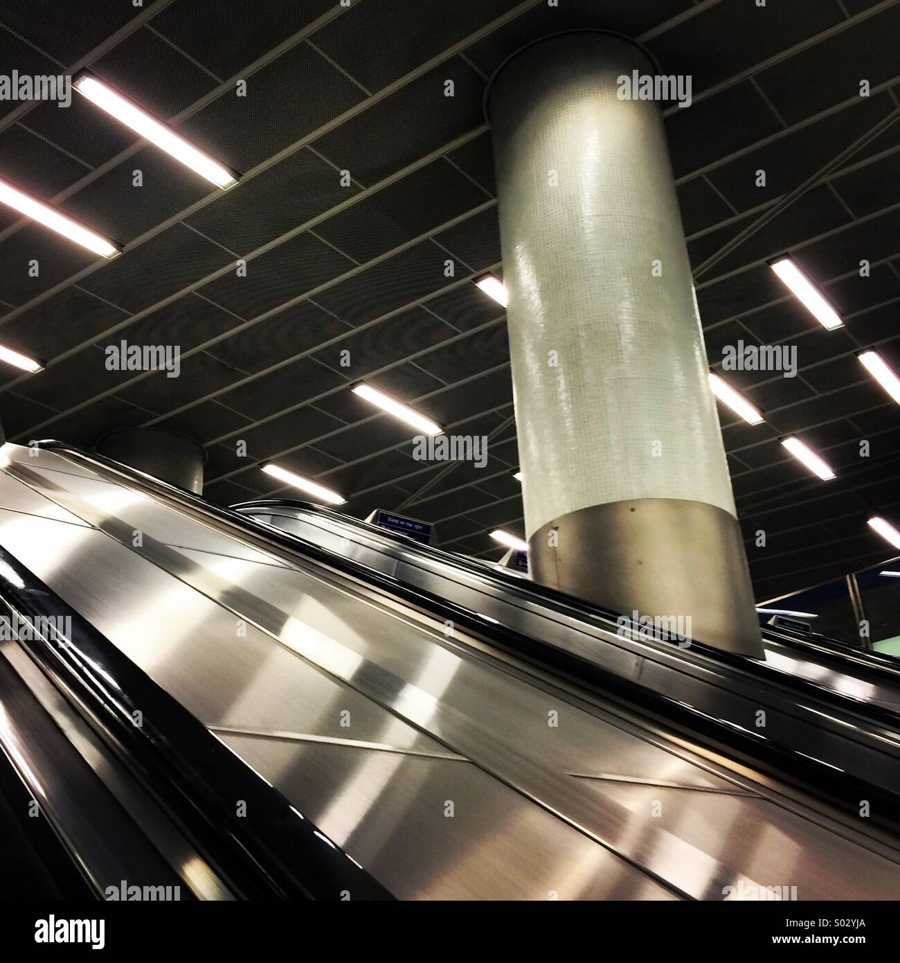 Escalators with strip lighting Stock Photo - Alamy