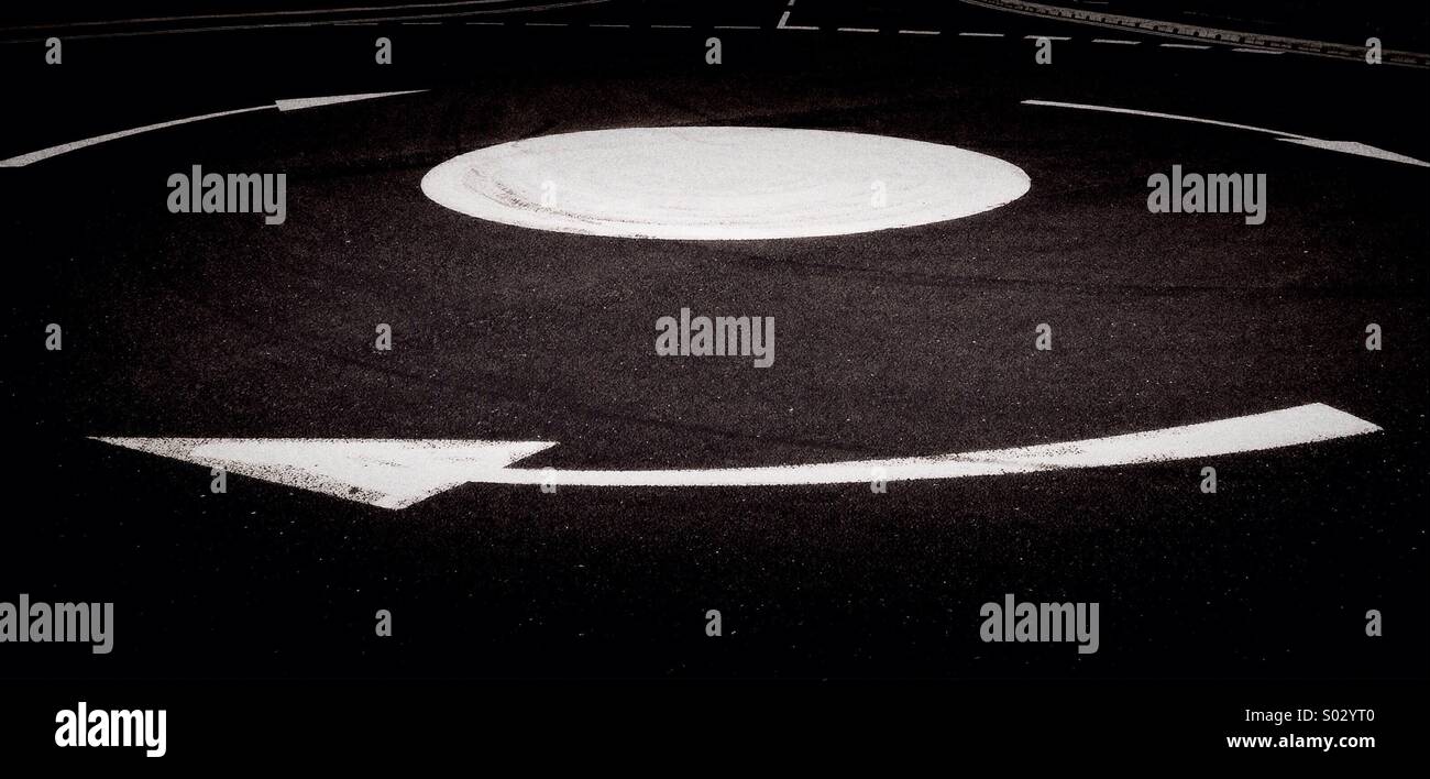 Mini roundabout road markings Stock Photo - Alamy