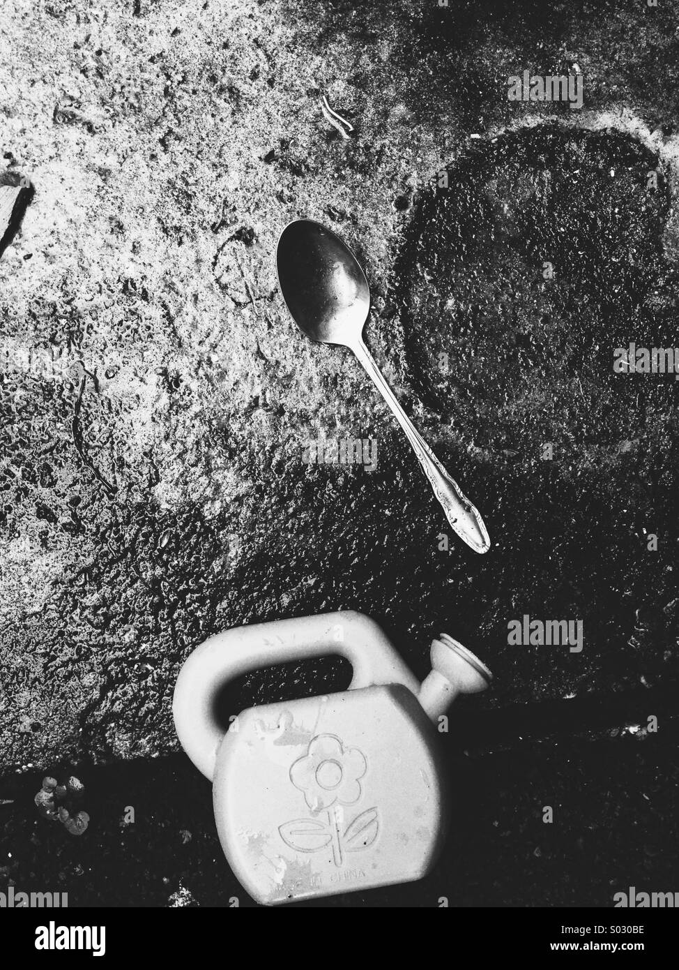 Little water can and spoon Stock Photo - Alamy