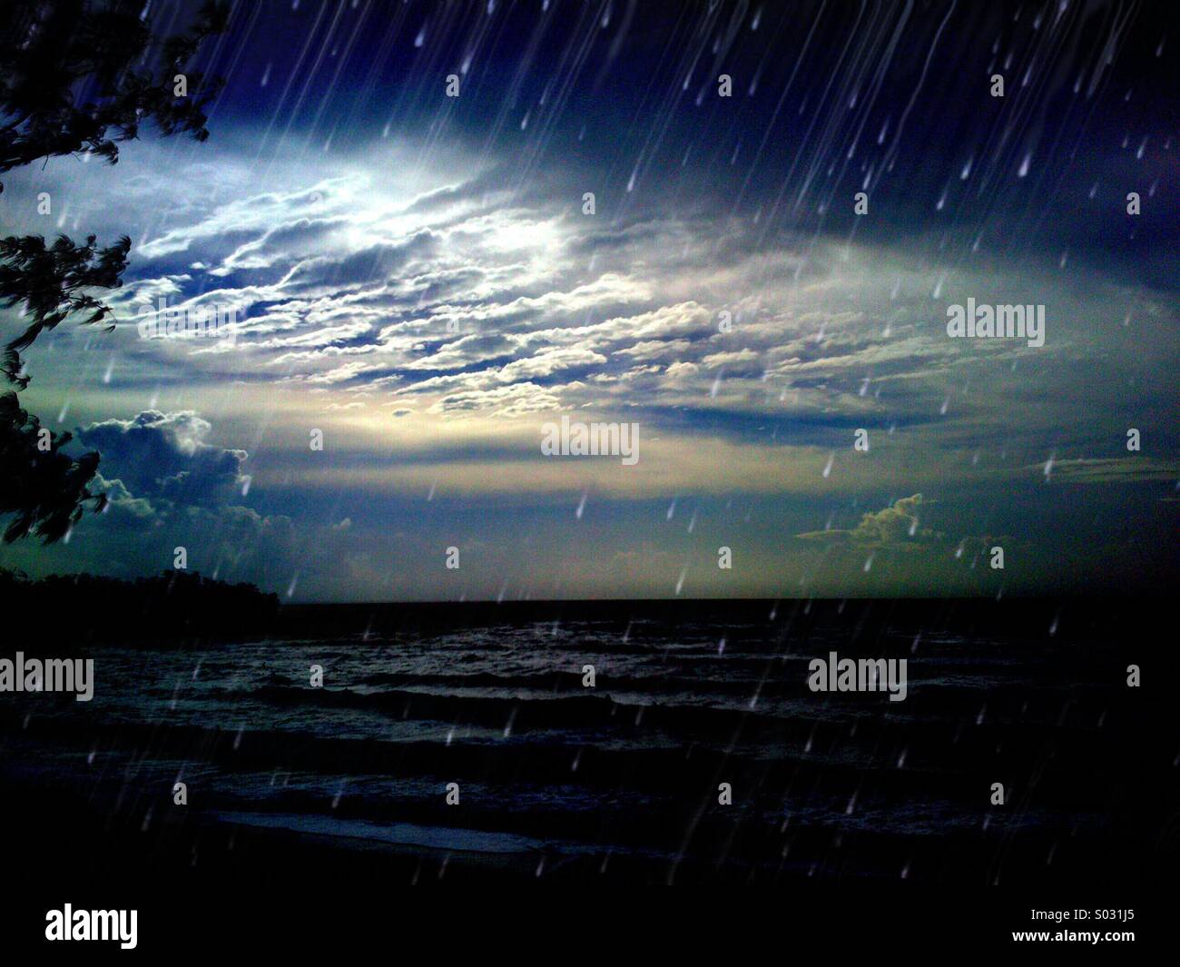 Rain at the beach Stock Photo - Alamy