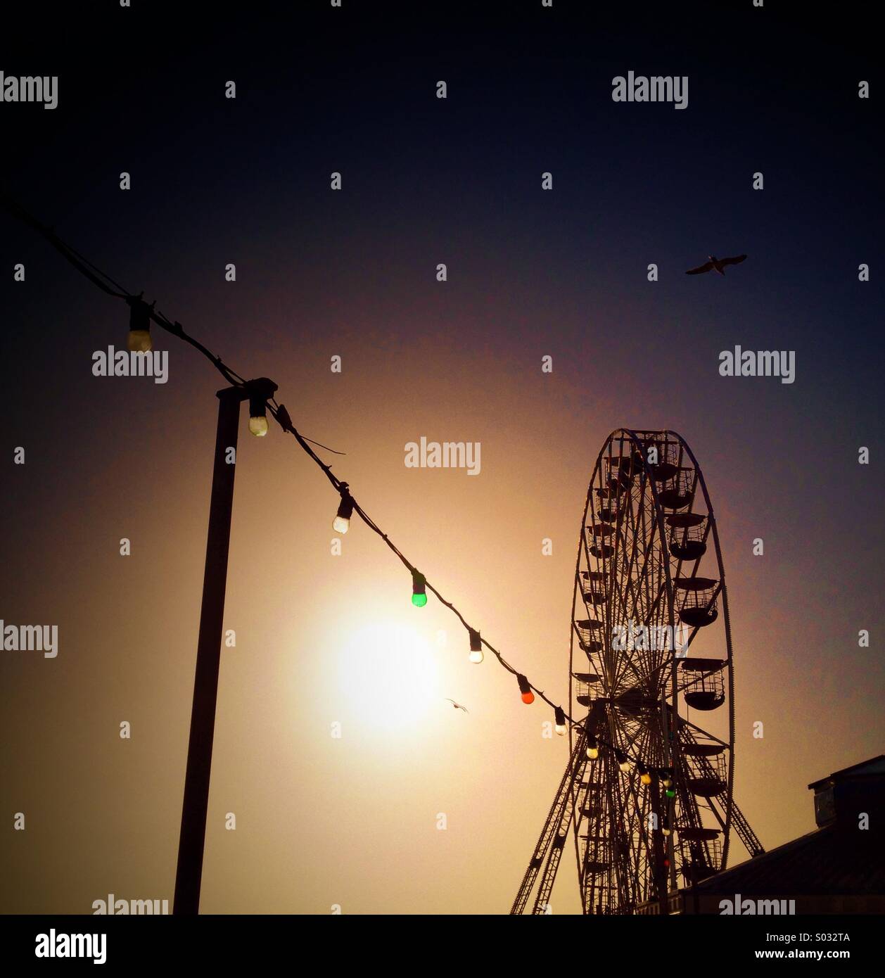 Big wheel on Blackpool Central Pier against sun Stock Photo - Alamy