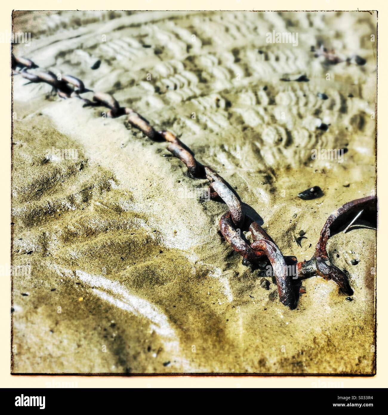 Chain in the sand Stock Photo - Alamy