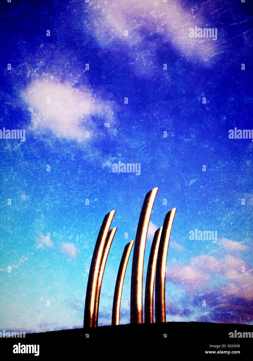 Pipe sculpture and white clouds Stock Photo - Alamy