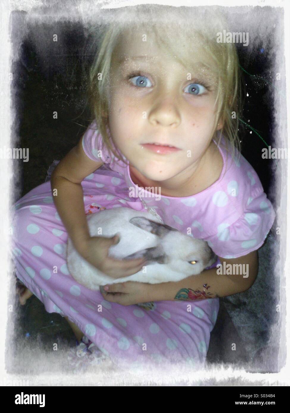 Child with a rabbit Stock Photo - Alamy
