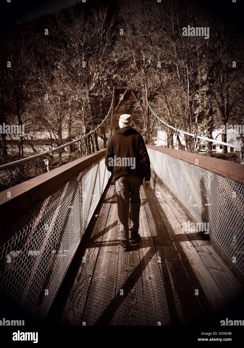 Walking over bridge Stock Photo - Alamy