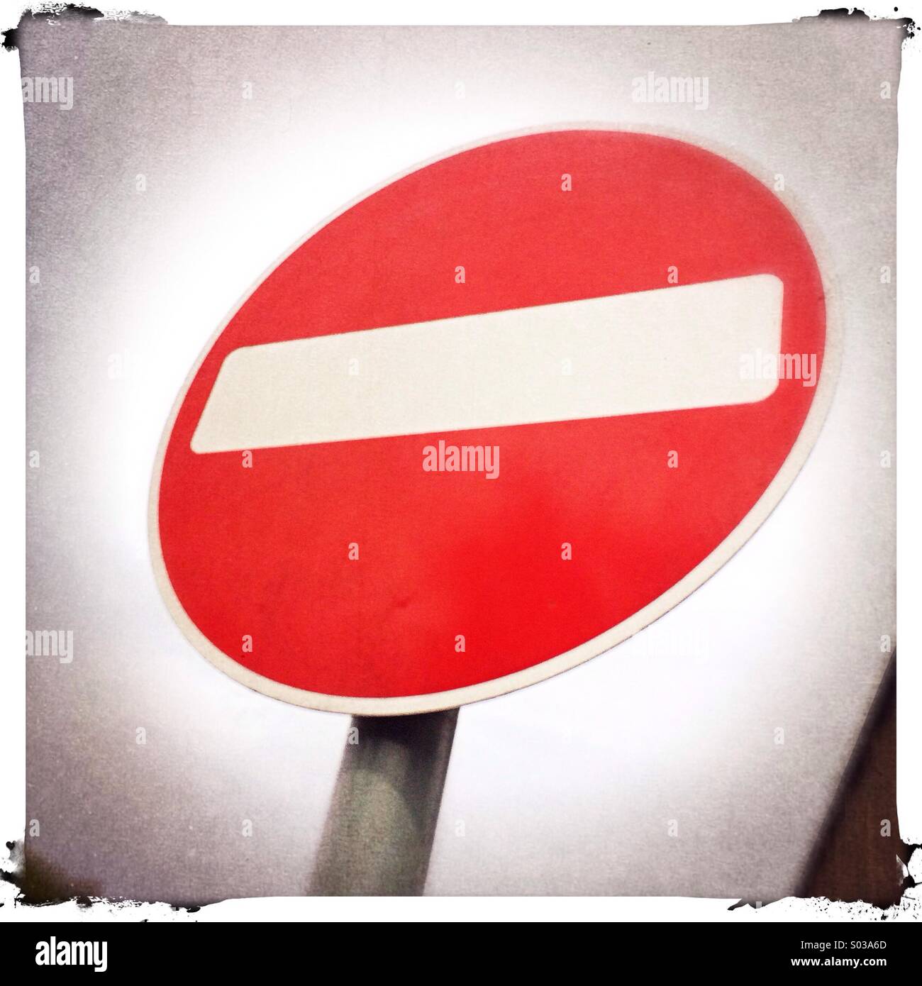 No entry sign against a grey sky, UK Stock Photo - Alamy