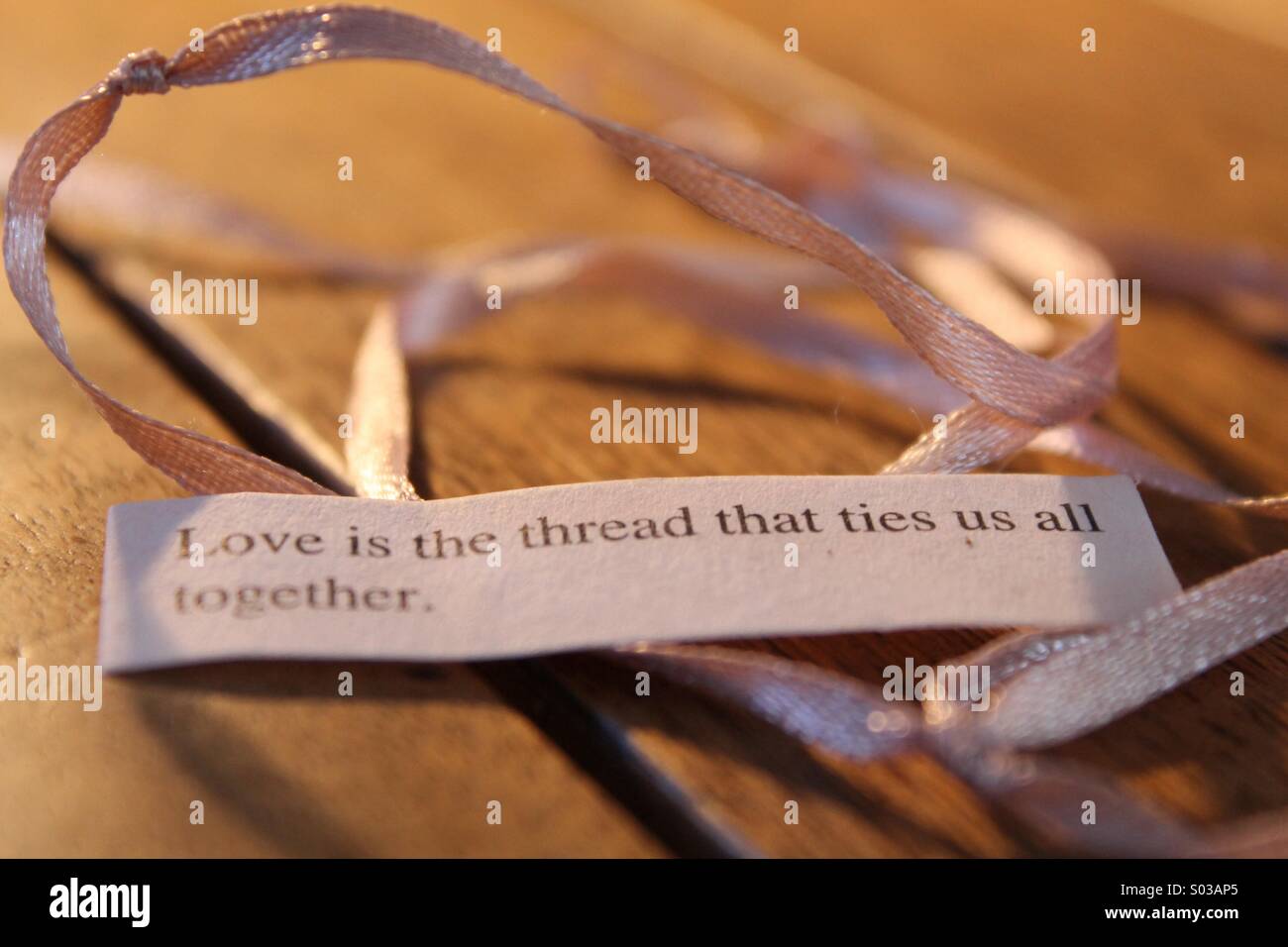 Love is the thread Stock Photo - Alamy