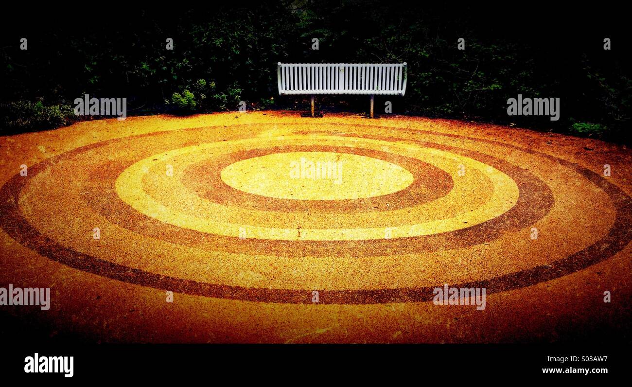 Metal bench and concentric circle pattern Stock Photo - Alamy