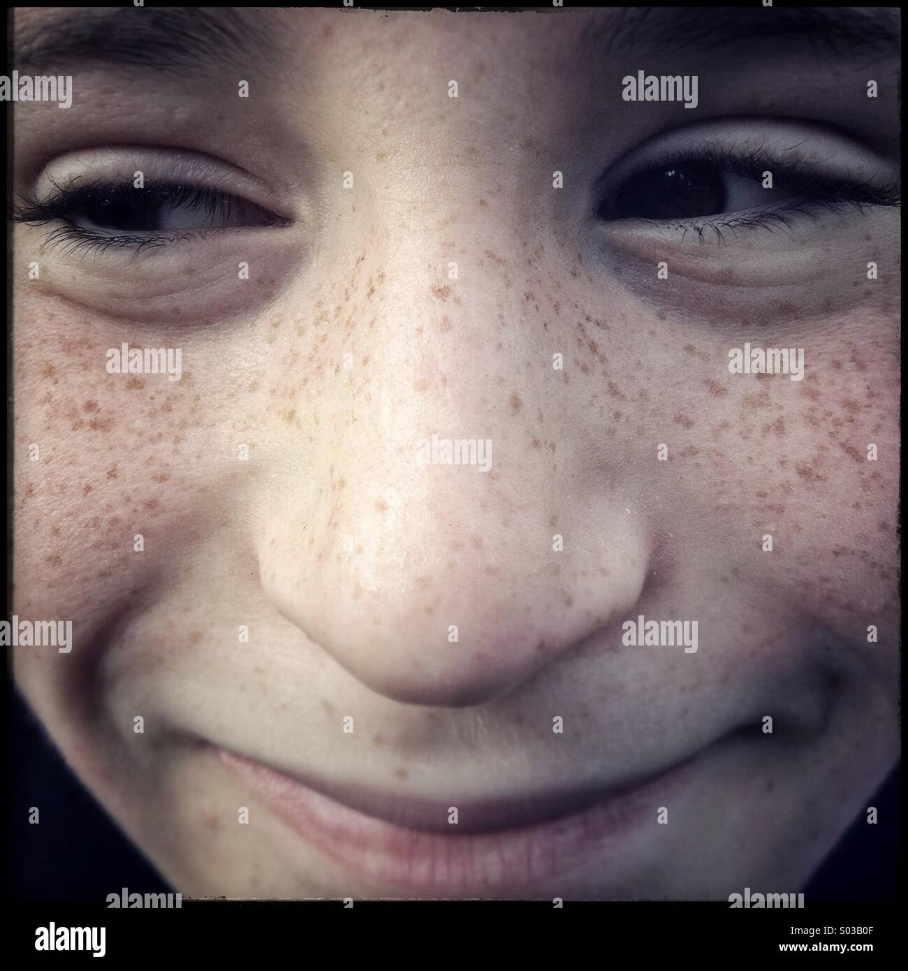 Close up face of young cheeky boy smiling Stock Photo - Alamy