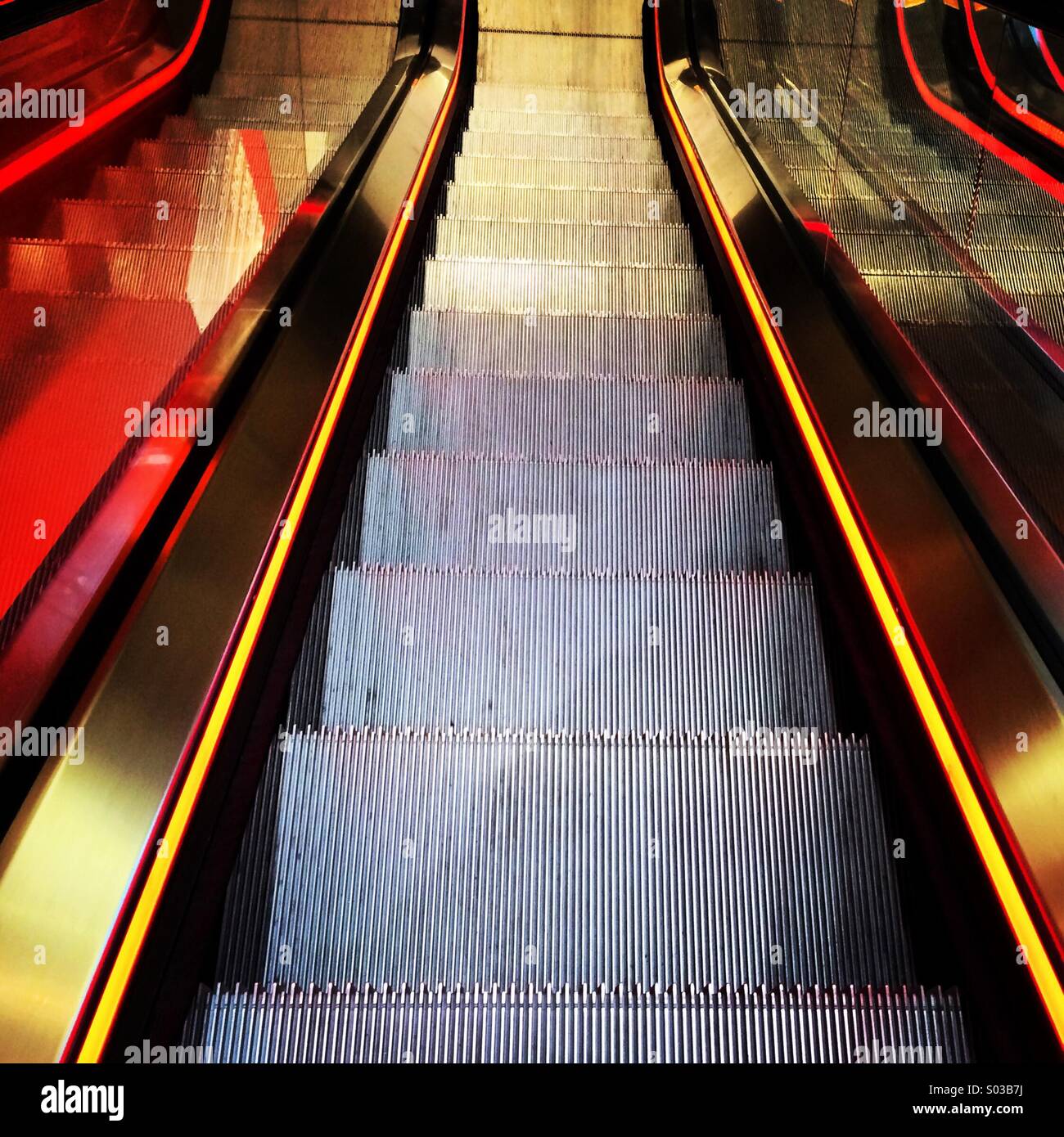 Neon illuminated escalator Stock Photo - Alamy