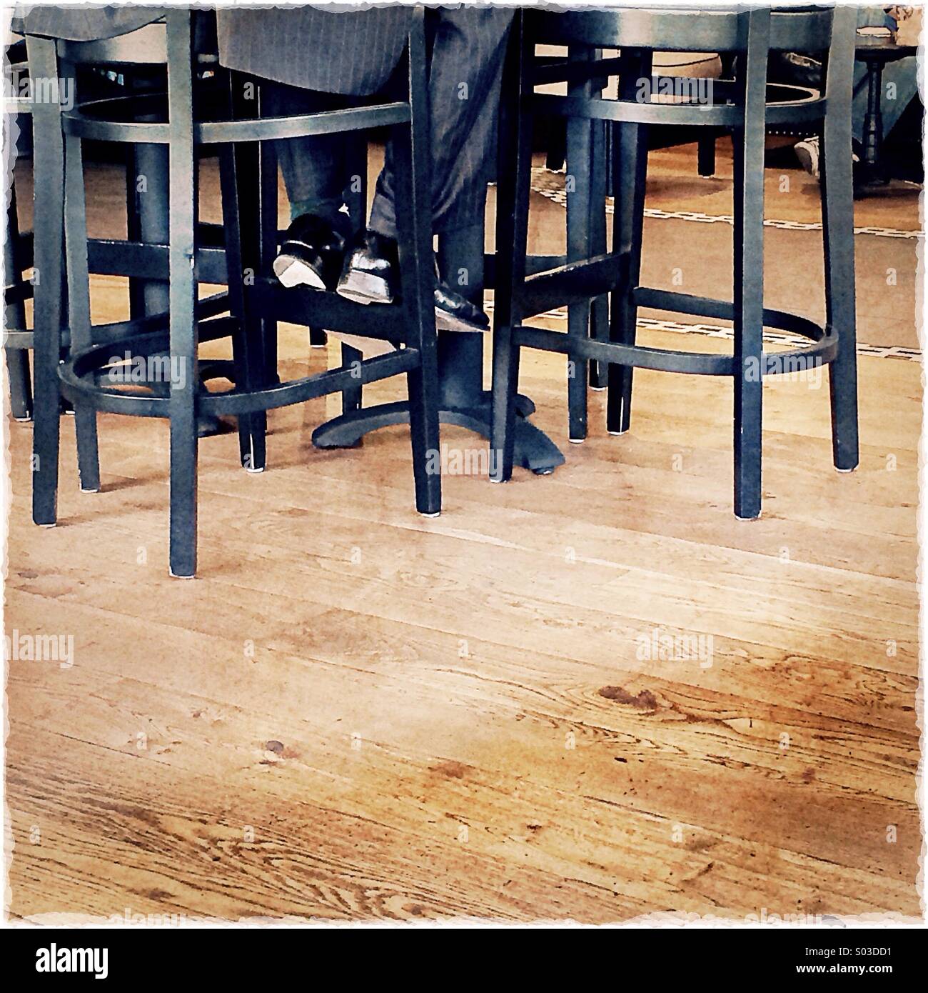 Person sitting on a chair hi-res stock photography and images - Alamy